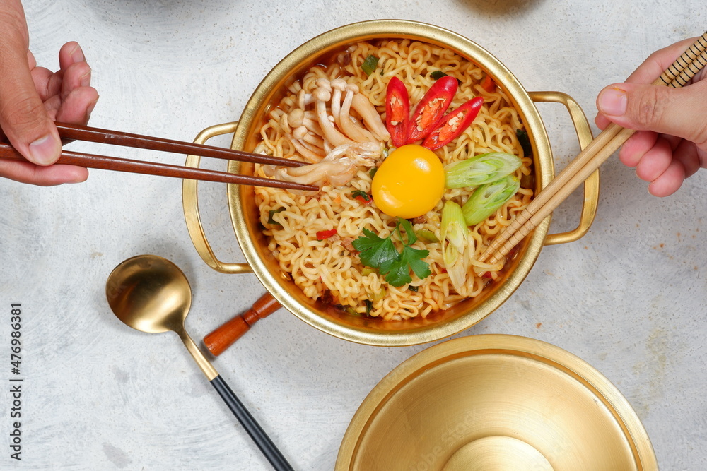 Serving a Korean style instant noodle, Ramyeon or Ramyun with spicy ...