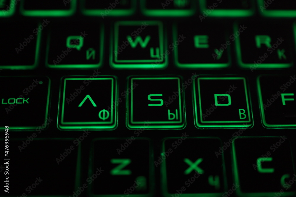 Laptop keyboard with green backlight. Hot keys for the game Stock Photo ...