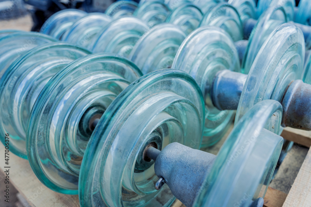 Rows of glass insulators for high voltage power line Stock Photo ...