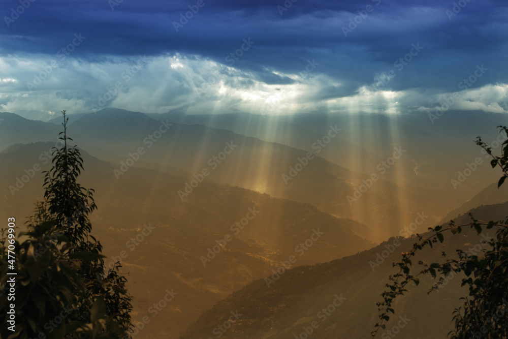 Sun rays coming out of cloud burst - at Rabangla, Sikkim, India. Trees ...