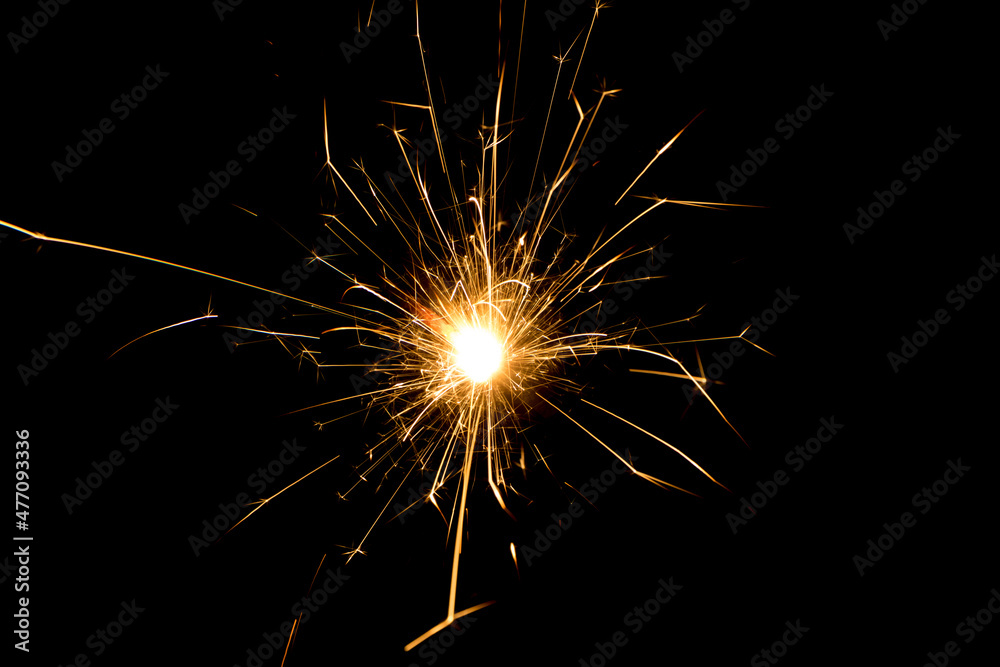 One sparkler on isolated black background Stock Photo | Adobe Stock