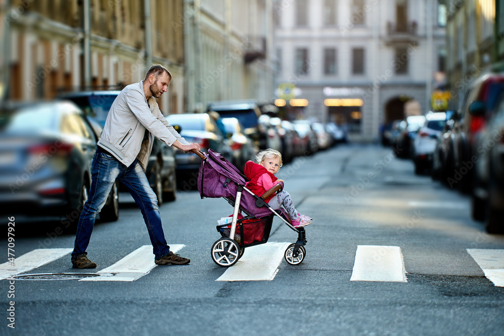 Father with daughter in buggy on street of St. Petersburg. Stock-Foto ...