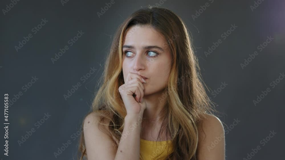 Blonde millennial girl agitated scared stressful nervous thinking ...