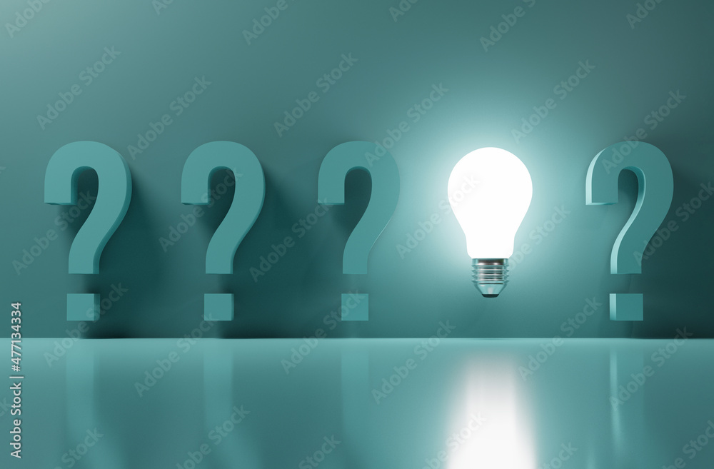 Glowing lightbulb among question mark on green background for creative ...