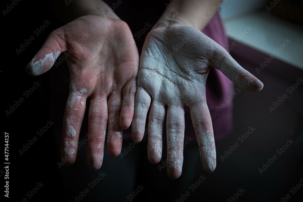 beautiful women's hands smeared in white paint after working with their ...