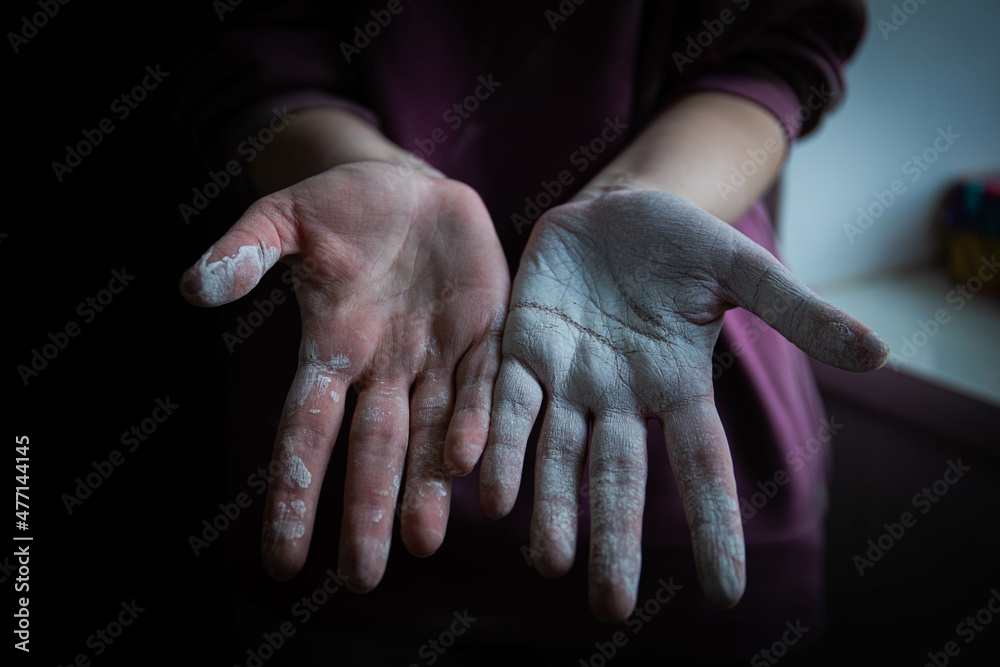 beautiful women's hands smeared in white paint after working with their ...