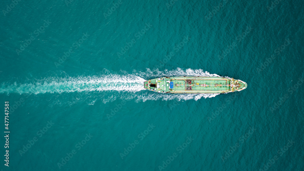Oil ship tanker full speed with beautiful wave and splash water in line ...