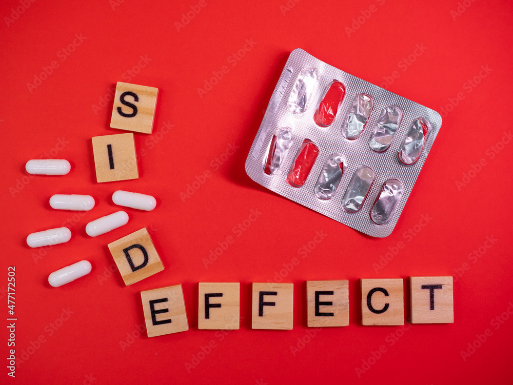 Words side effect on colored red paper texture background. Concept ...