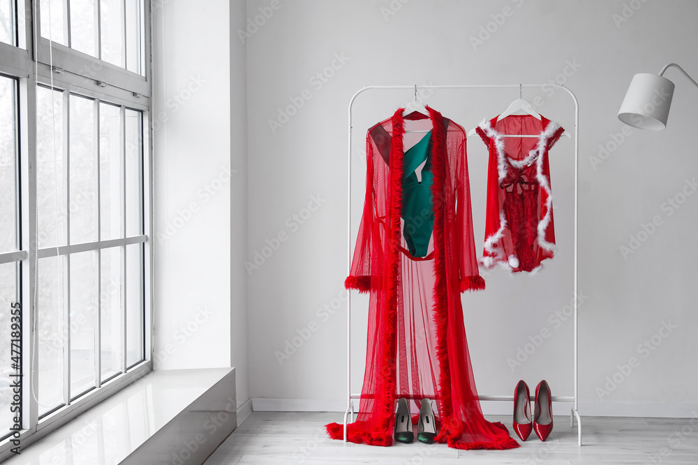 Sexy female underwear hanging on rack in room Stock Photo | Adobe Stock