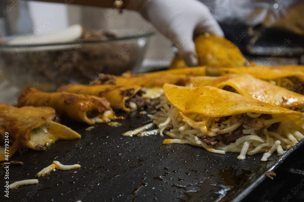 Tacos de birria, tacos fritos de carne y queso Stock Photo | Adobe Stock