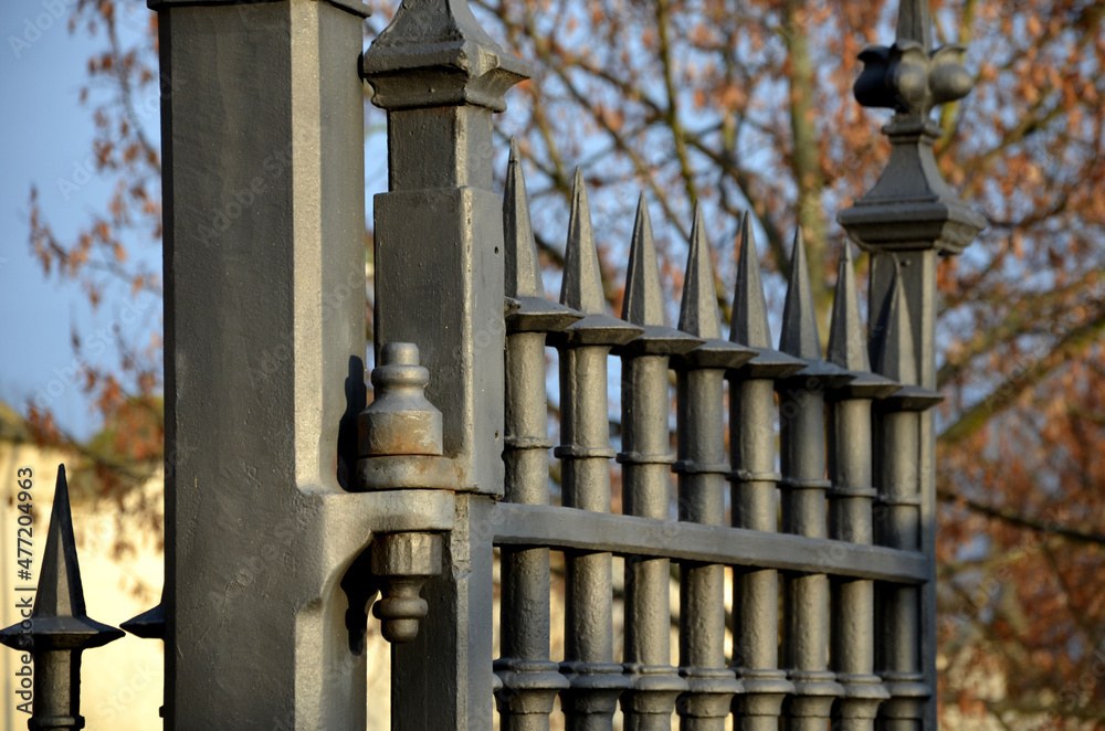 gate and fence at the castle in the autumn sun. the lattice ending the ...