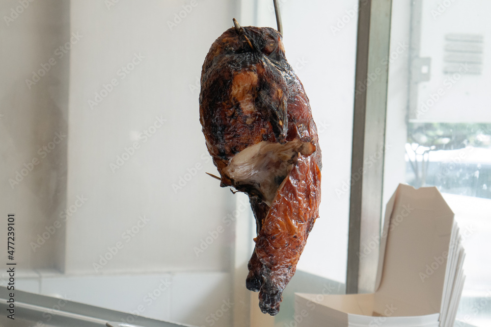 Hanged roasted chicken in restaurant. Roasted Chicken showcase hanged ...