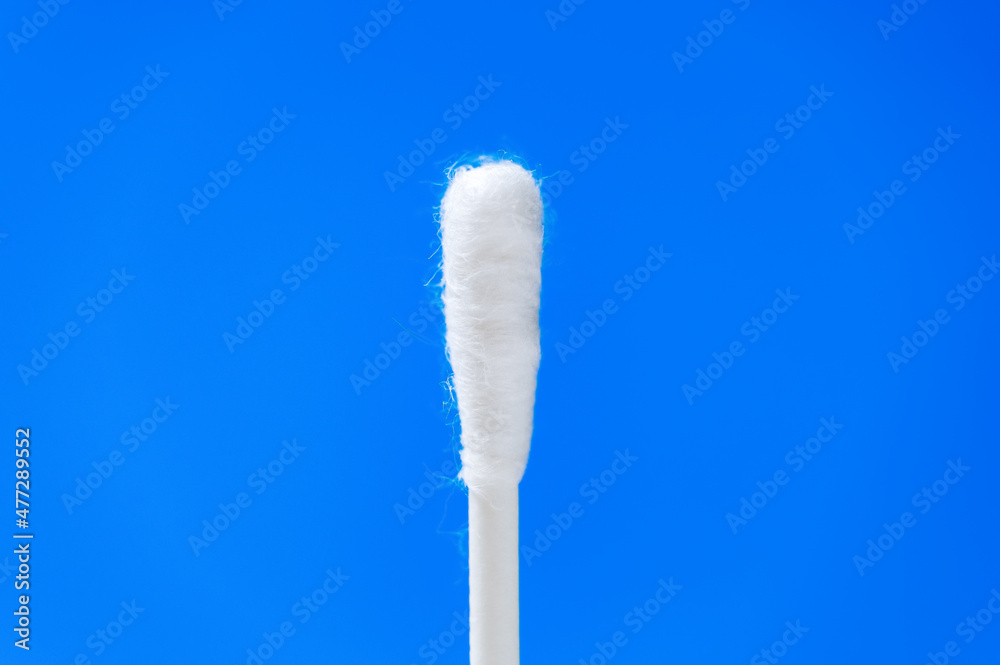 White cotton swab or or cotton bud against blue background. Coronavirus ...