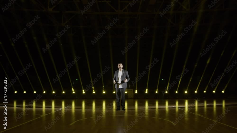 Famous Showman, artist in black suit performs on stage 4K. The ...