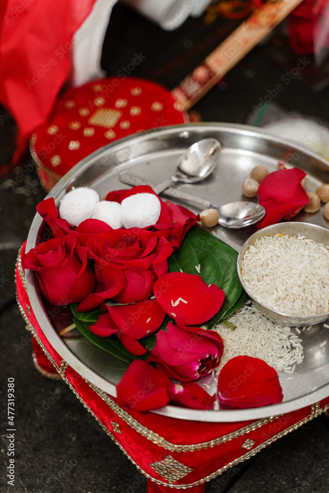 Wedding ceremony Red rose with Diwali Diya kept in the middle Used for ...