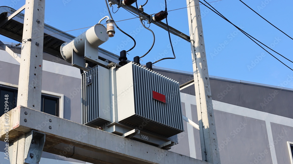 Transformer on concrete column beams. Three phase oil type transformer ...