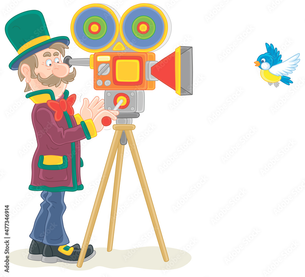 Retro filmmaker in a top hat with his old camera making a film with a ...
