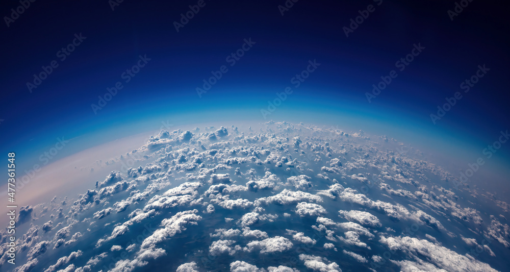 Curvature of planet earth. Aerial shot. Blue sky and clouds Stock Photo ...