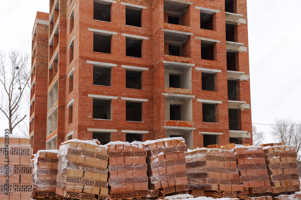 Brick Construction Building. Brick Pallettes in Construction Site ...