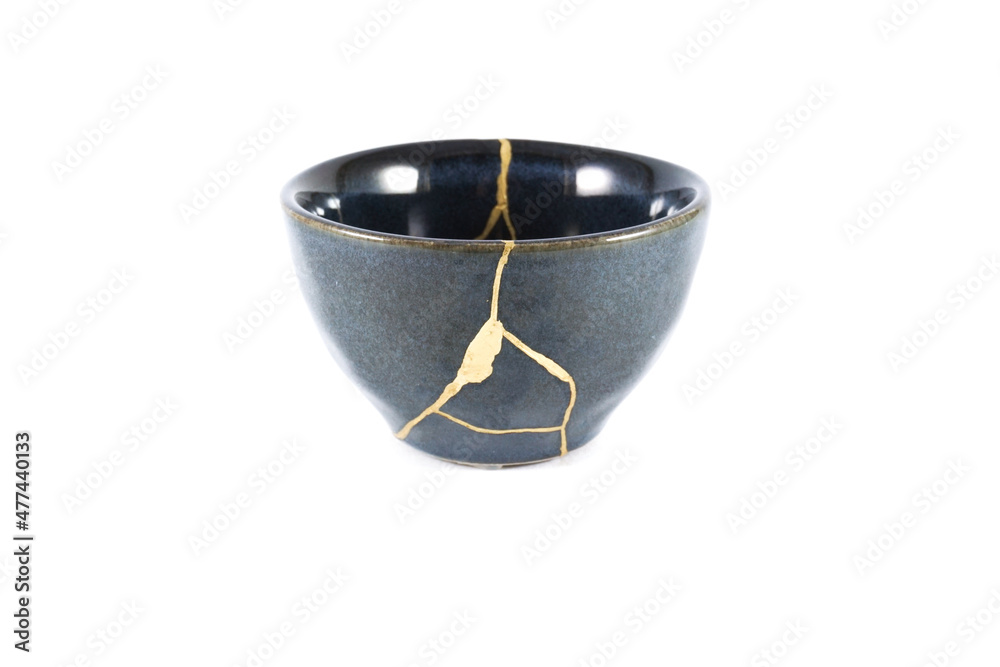 kintsugi gold cracks restoration, Japanese black bowl fixed with the ...