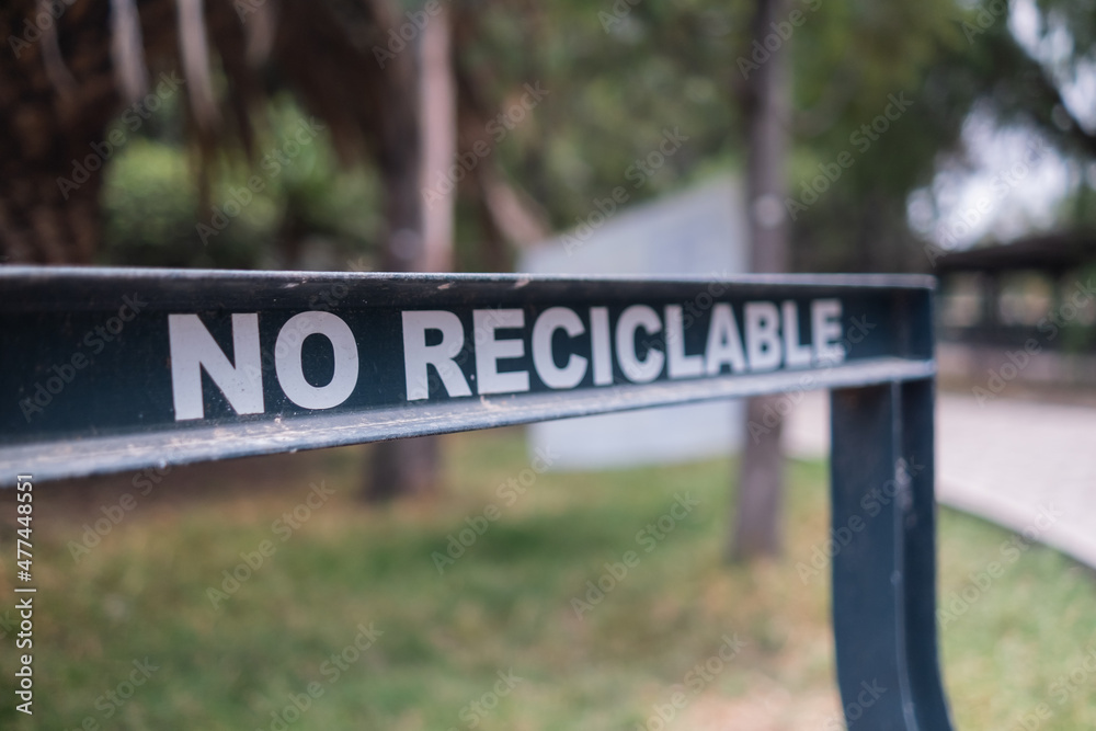 Spanish sign for non-recyclable trash with trees as background Stock ...