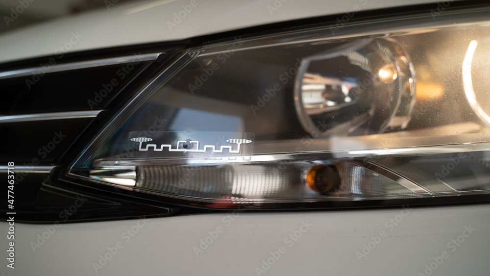 RFID sticker placed on the headlamp of a user car. RFID is a new ...