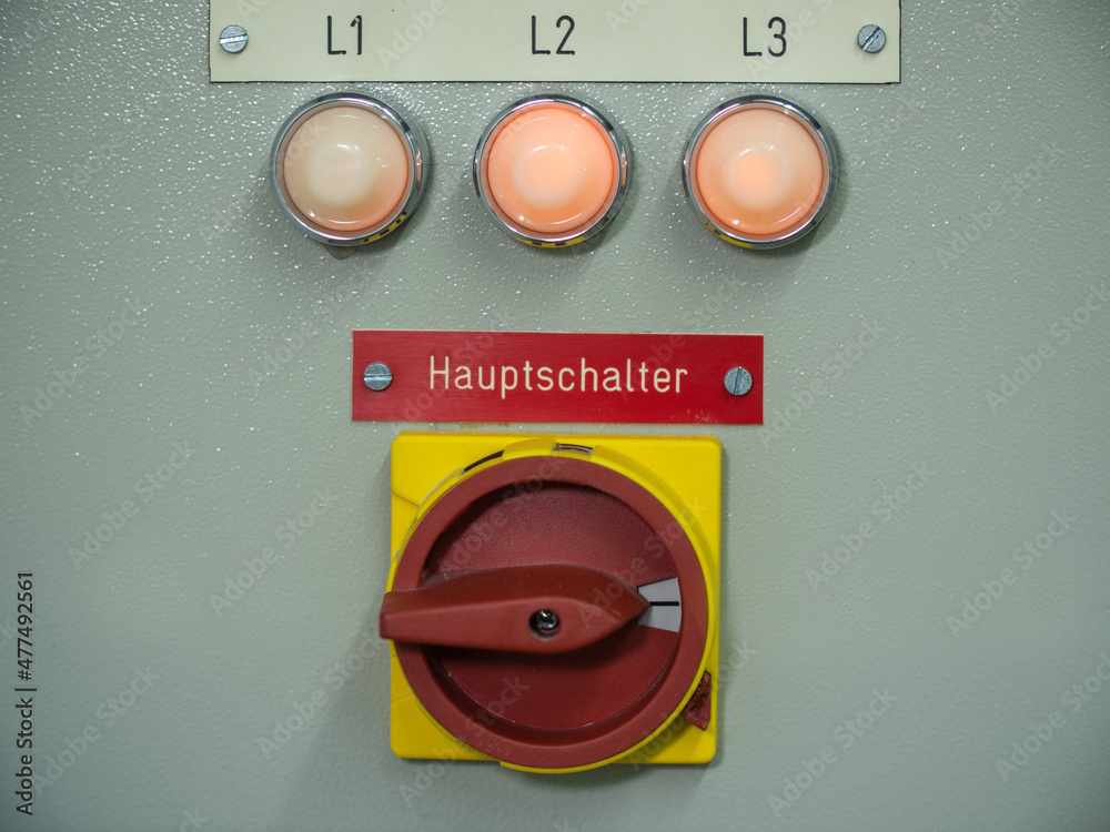 Main switch in red and yellow turned on or off on an electricity switch ...