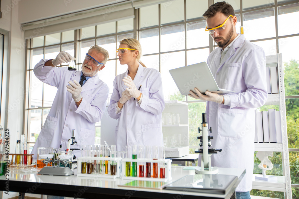 Medical Research and Scientists are working with a microscope and a ...