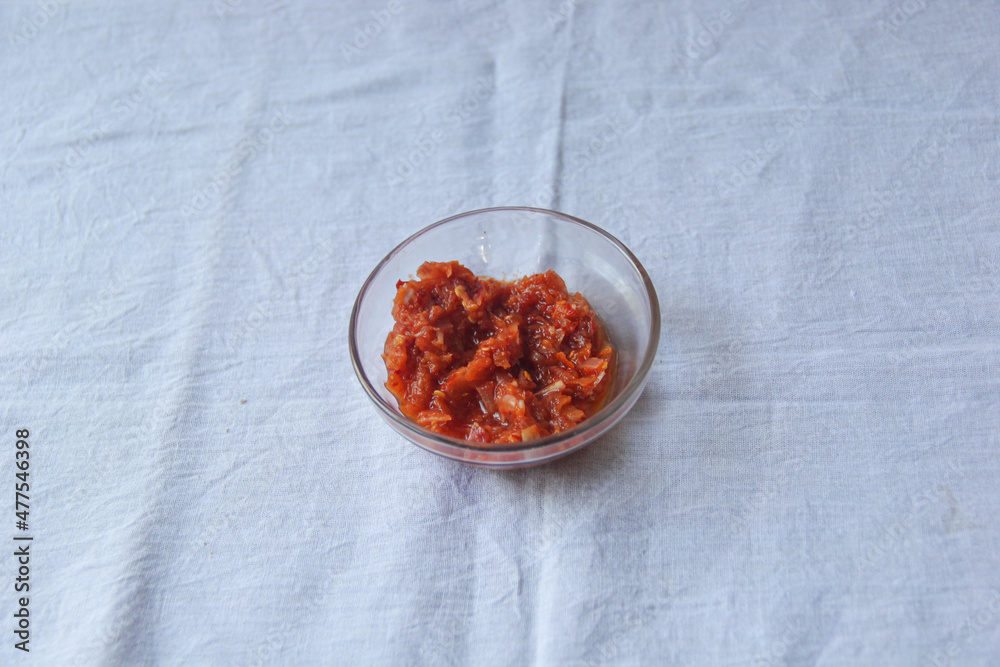 Lunu miris cup on the white background, hot chili pepper sauce paste ...