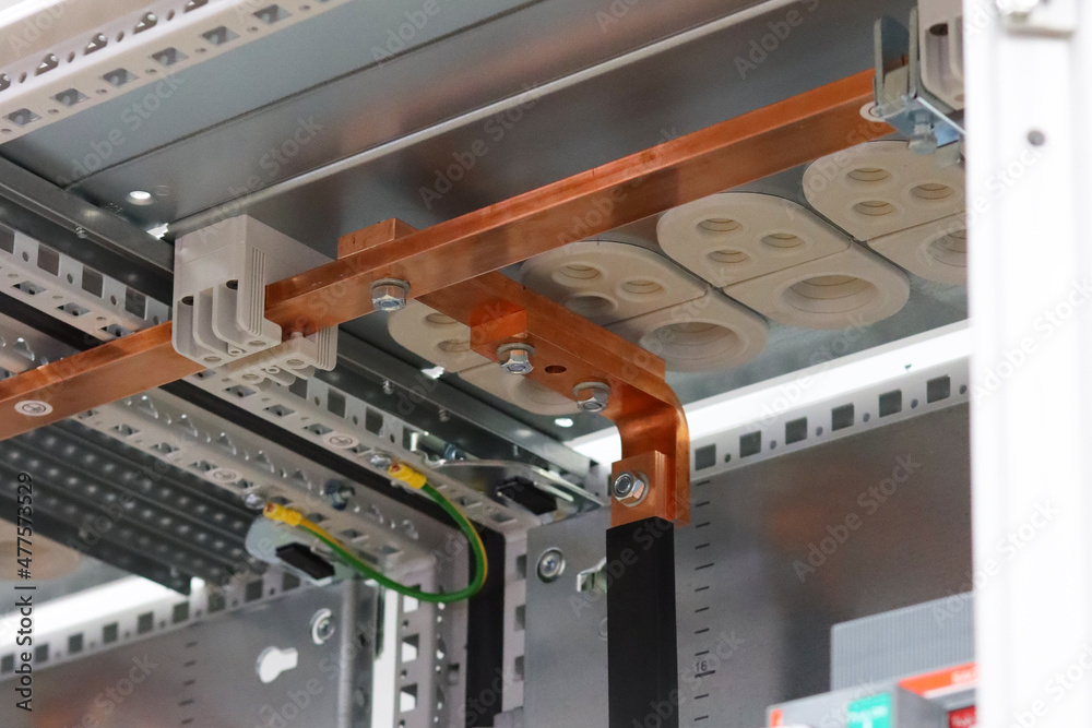 Copper electrical busbars for grounding fixed on plastic bases in the ...