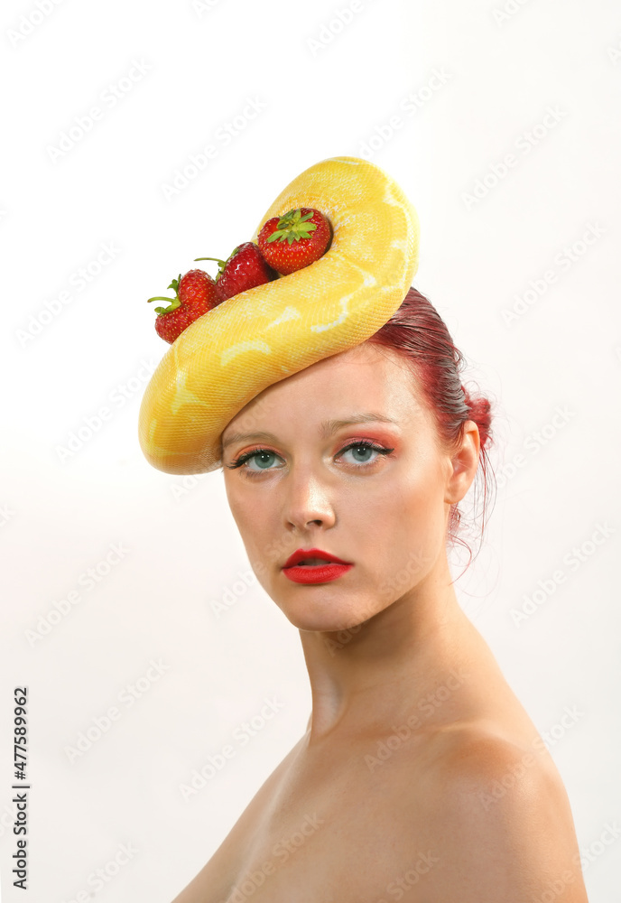 A beautiful young woman poses nude for the camera. She is seen with a ...