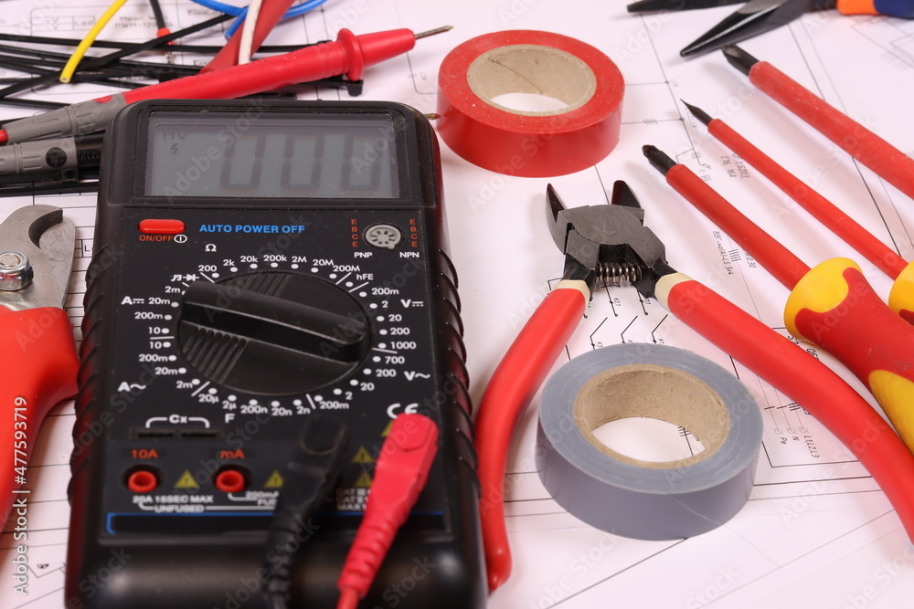Colored electrical wiring wires, mounting tools, multimeter, are ...