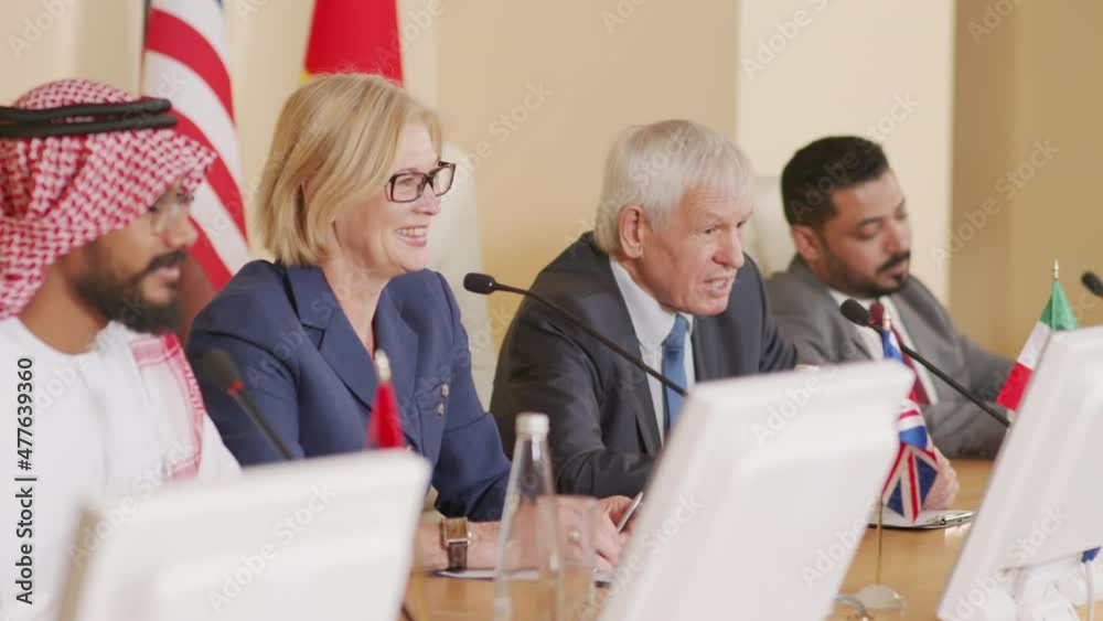Panning waist up shot of multiethnic male and female politicians ...
