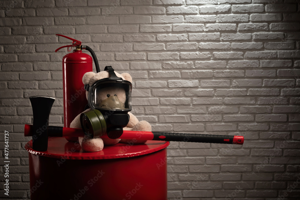 the mascot of the fire brigade is a teddy bear in a gas mask with a ...