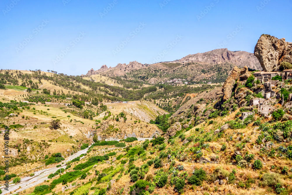 Small village of Pentedattilo, church and ruins of the abandoned ...