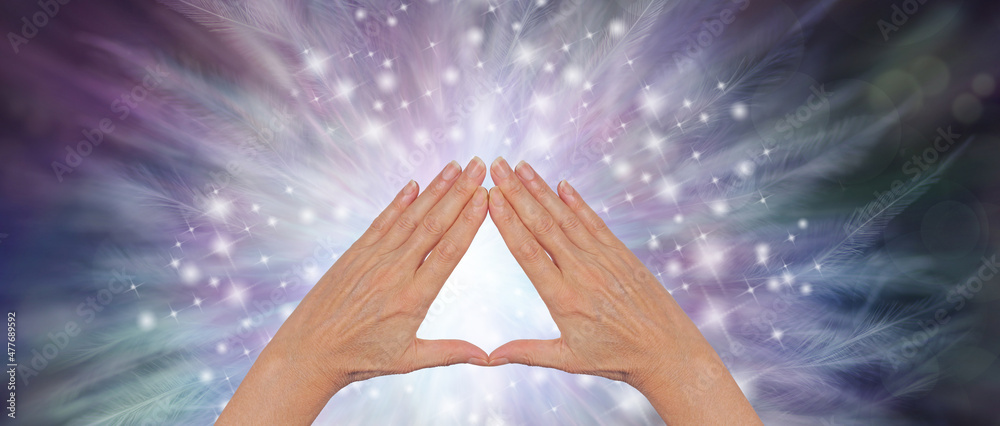 The triangle is a stunning healing tool - female hands making a ...