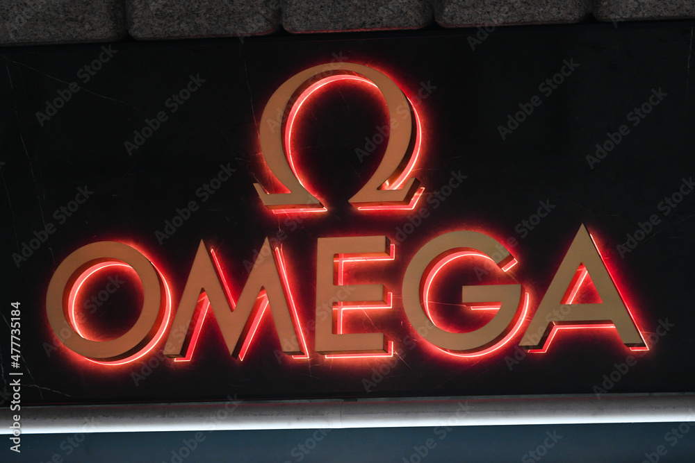 Omega logo displayed on a facade of a store in Milan. Stock Photo ...