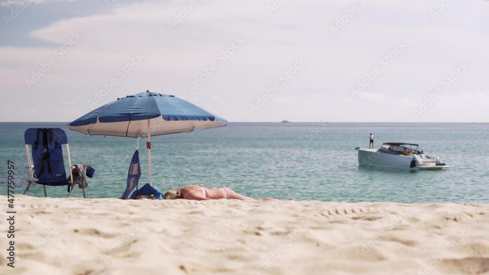 Women sleeping on the beach Stock Video | Adobe Stock
