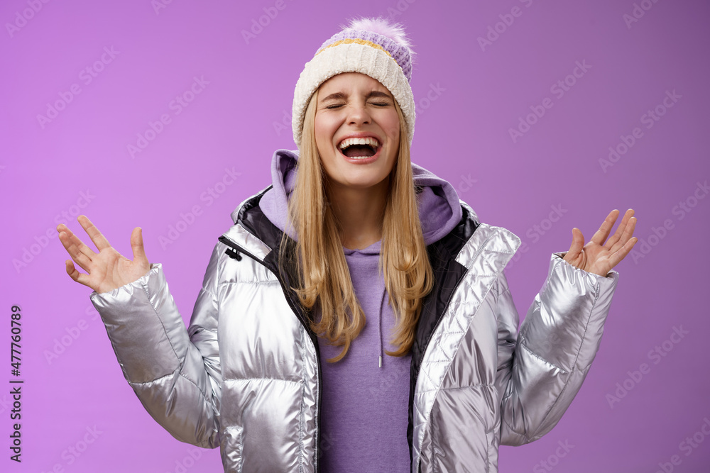 Joyful happy blond woman free emotions yelling happily having fun ...