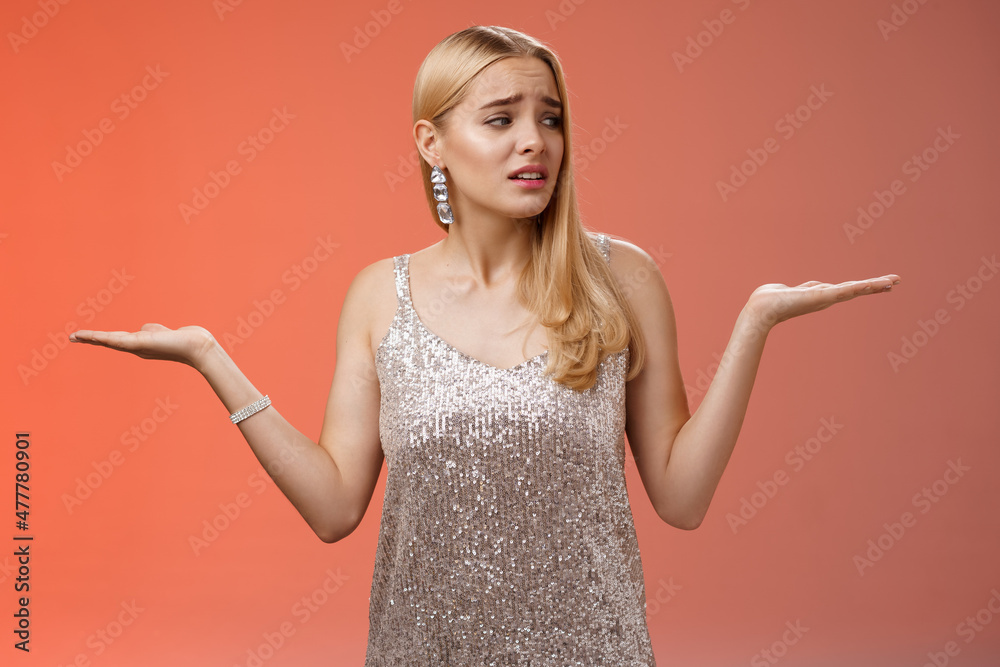 Anxious insecure young cute blond girl feel lost unsure shrugging hands ...