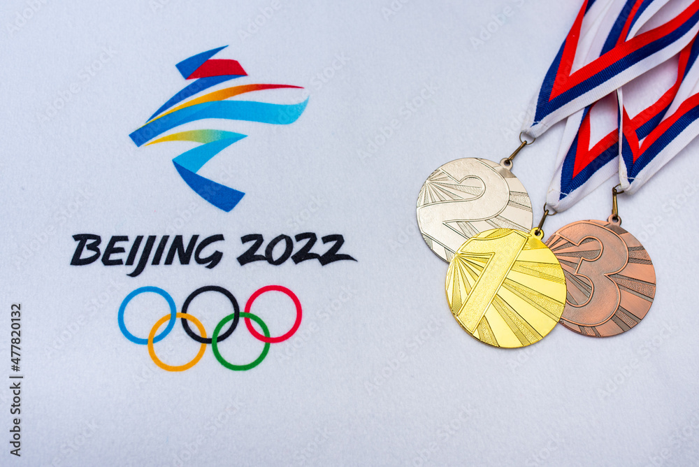 BEIJING, CHINA, JANUARY 1, 2022: Gold, silver and bronze, medal set on ...