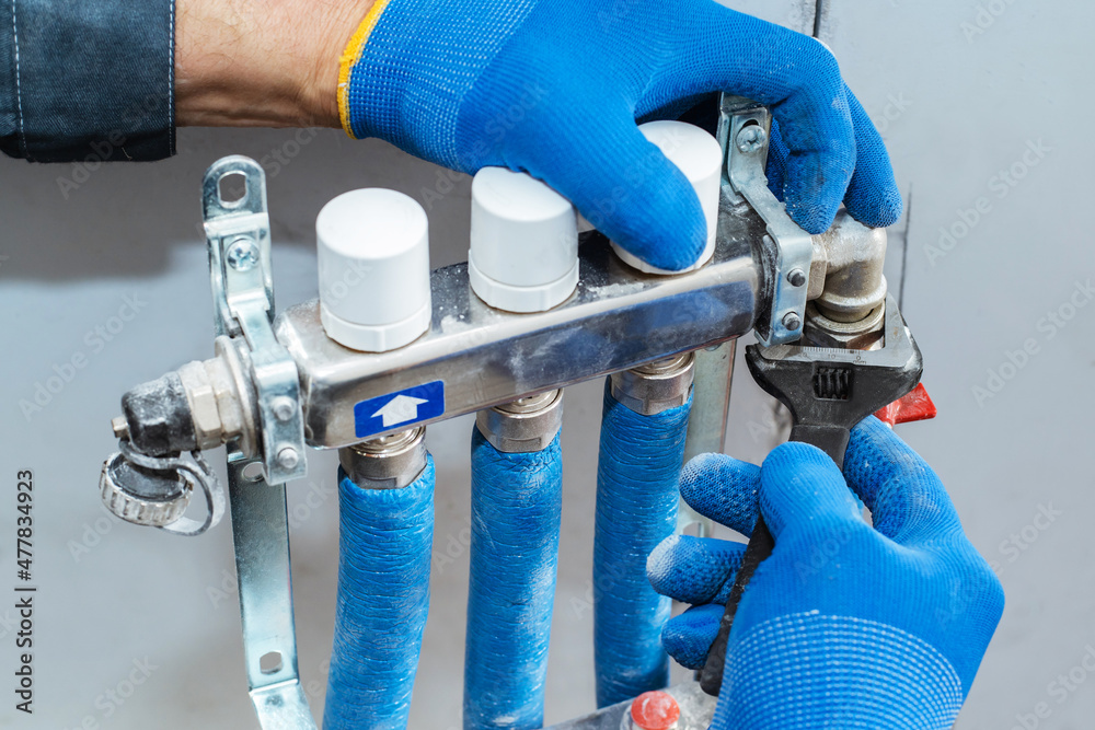 Installation of the heating system in the apartment. The process of ...