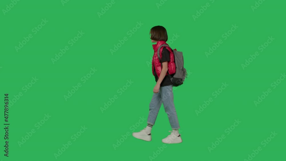 sad teen girl with backpack walking on Green Screen, Chroma Key. Side ...
