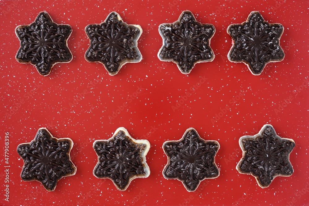 Winter treat, snowflake shaped Peppermint Bark chocolate candy on a ...