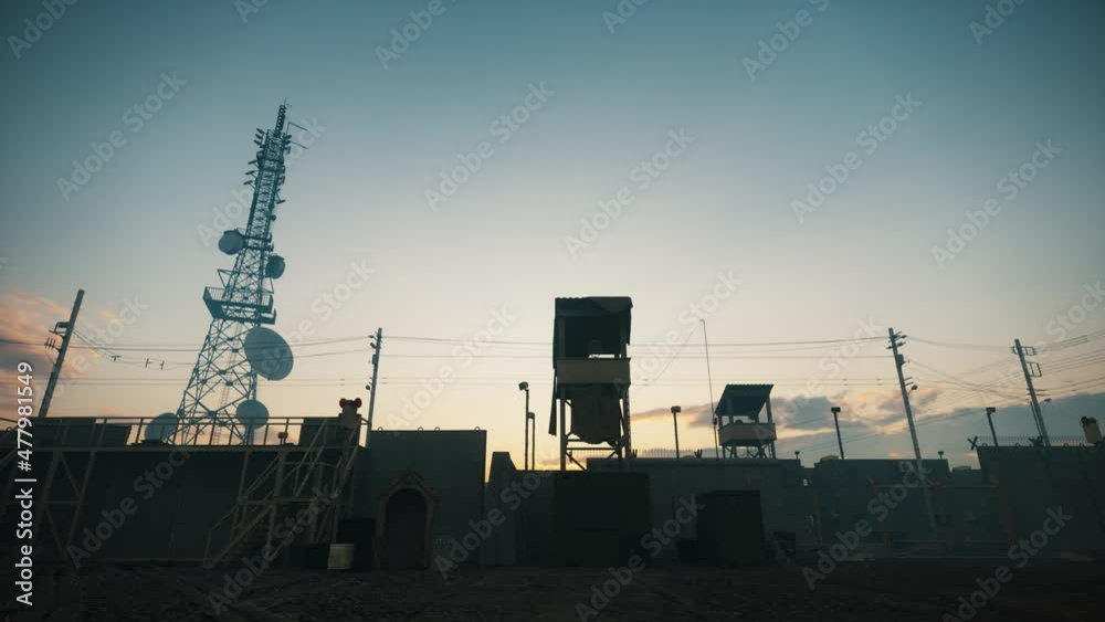 Checkpoint at the border fence. Military border. A silhouette of a ...