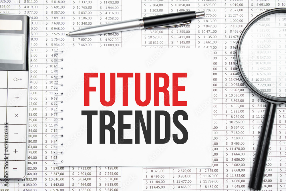 Future trends text on paper with calculator,magnifier ,pen on the graph ...