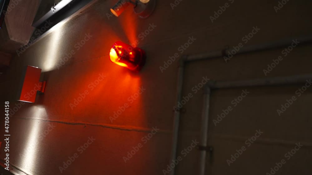 This video shows an active emergency red light siren rotating, flashing ...