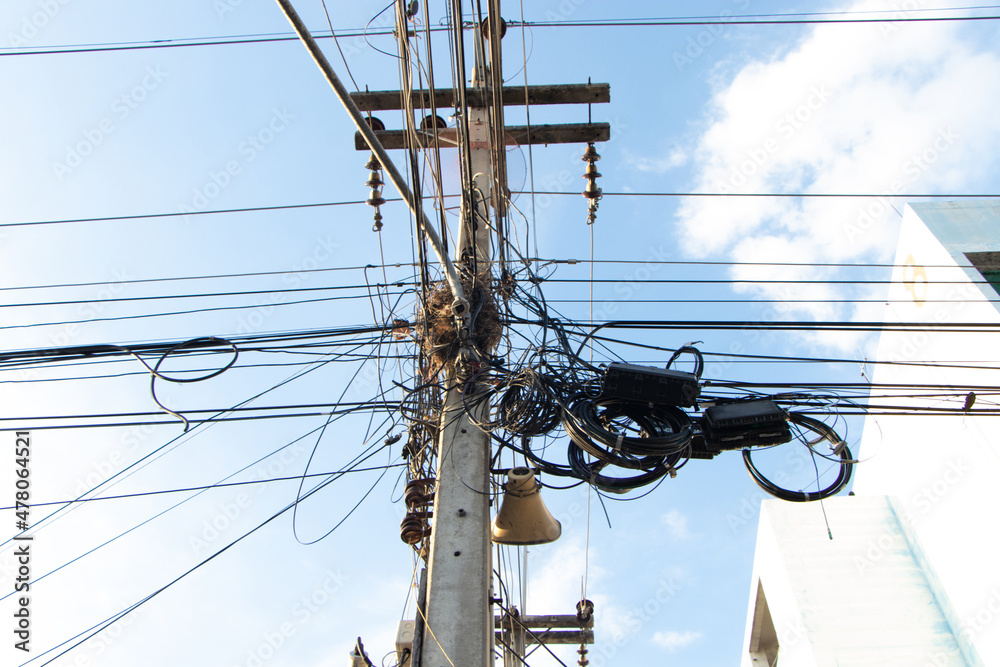 Bird's nest on top Super Mess Electricity Wires. Black fiber optic ...
