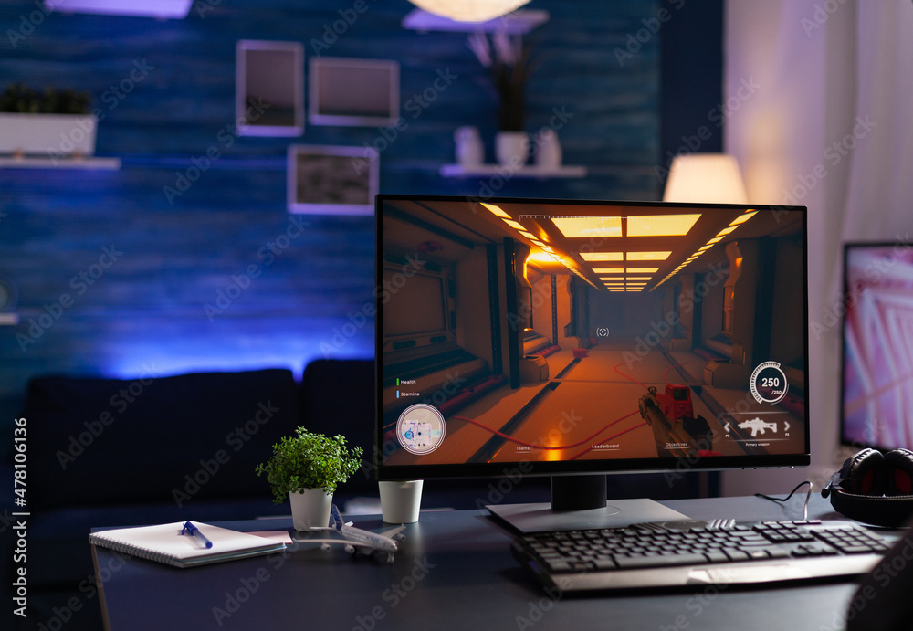 Nobody at desk with online video games on computer to play with ...