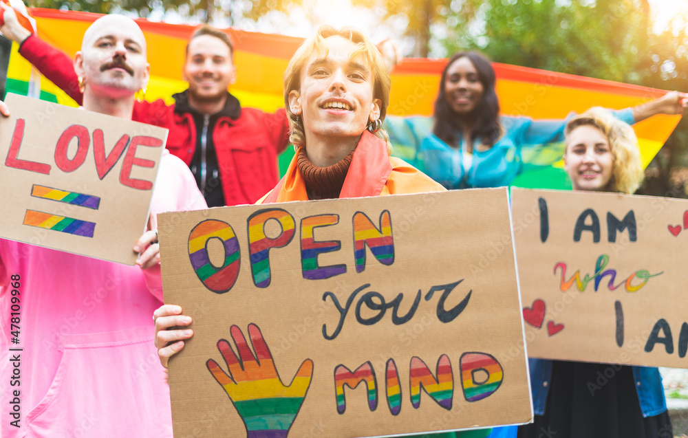 Group of people demonstrating for LGBTQ+ community rights and against ...